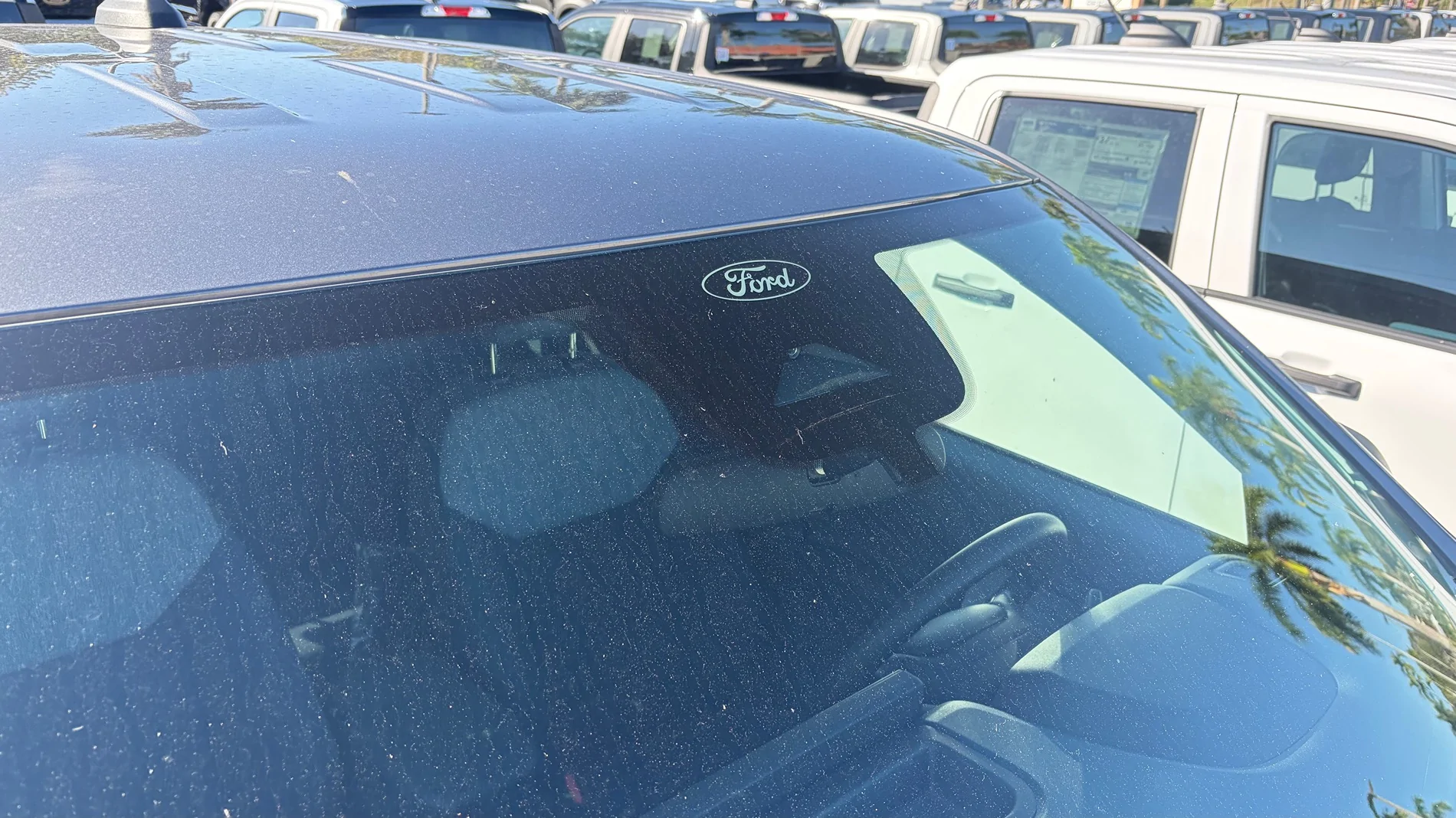 Ford logo above front windshield camera and safety sensor ...